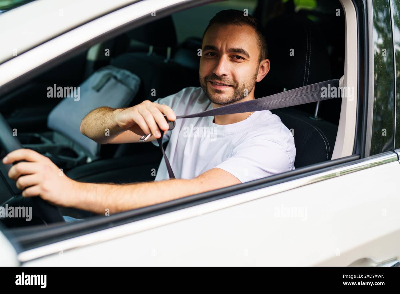 Man passenger sitting in seat fastening belt hi-res stock photography ...