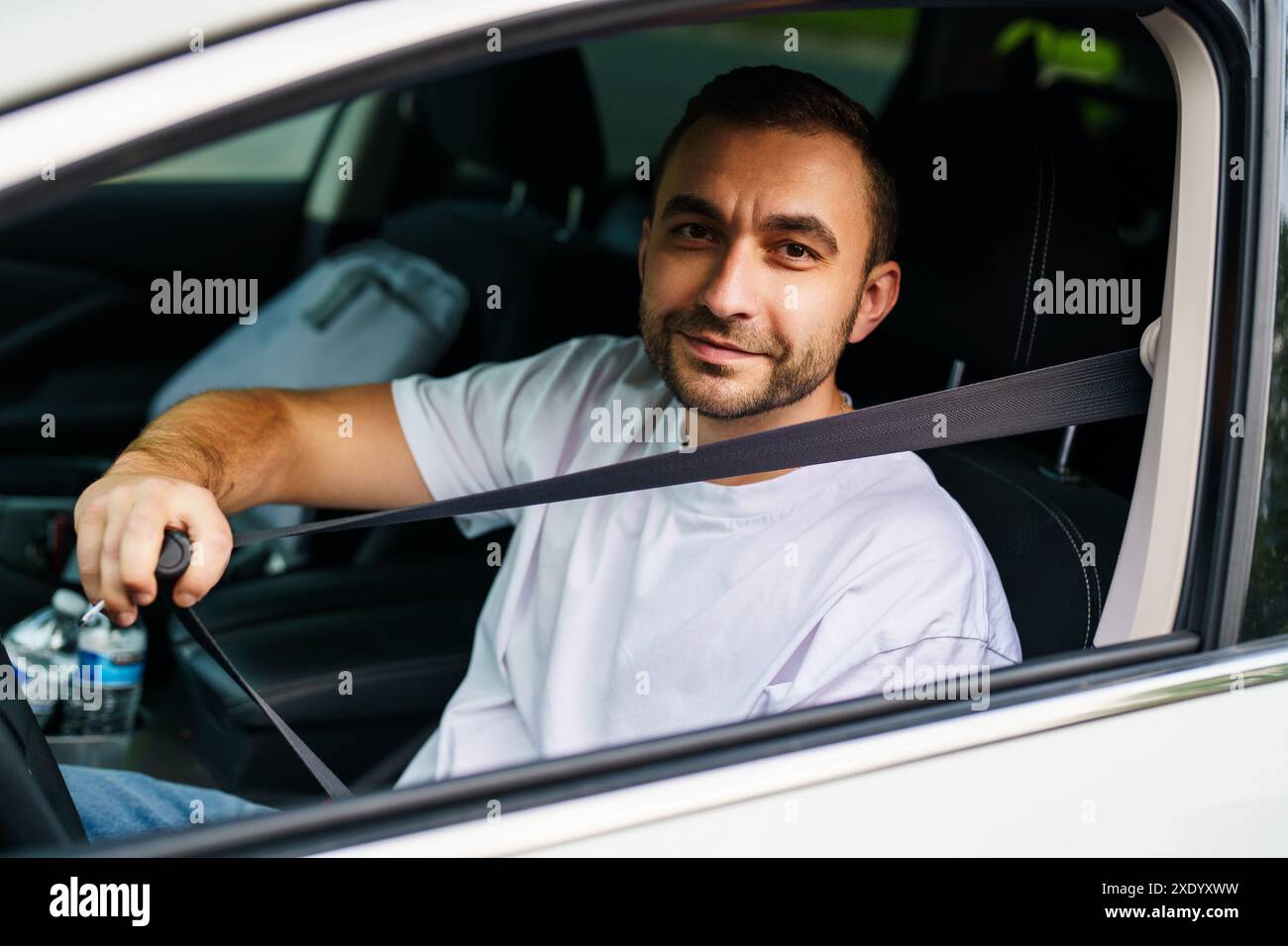 Man passenger sitting in seat fastening belt hi-res stock photography ...