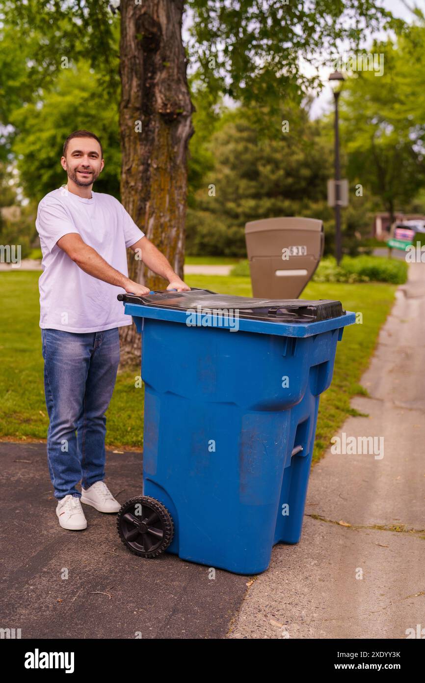 Man is throwing away bags of trash hi-res stock photography and images ...