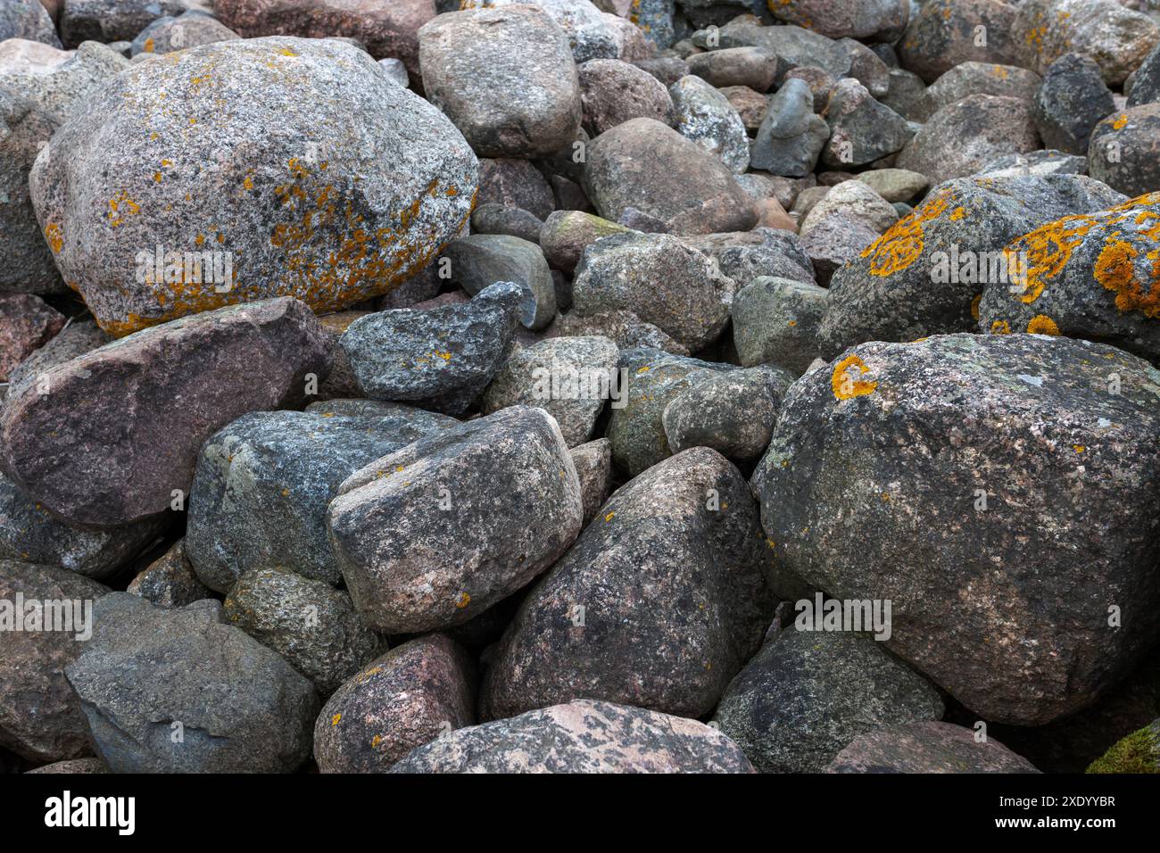 Huge boulders scattered randomly on the site of an old stone pier ...