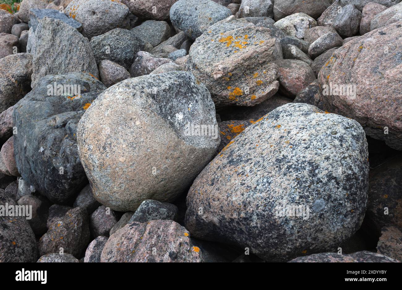 Huge boulders scattered randomly on the site of an old stone pier ...