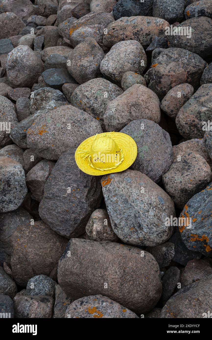 Huge boulders scattered randomly on the site of an old stone pier ...