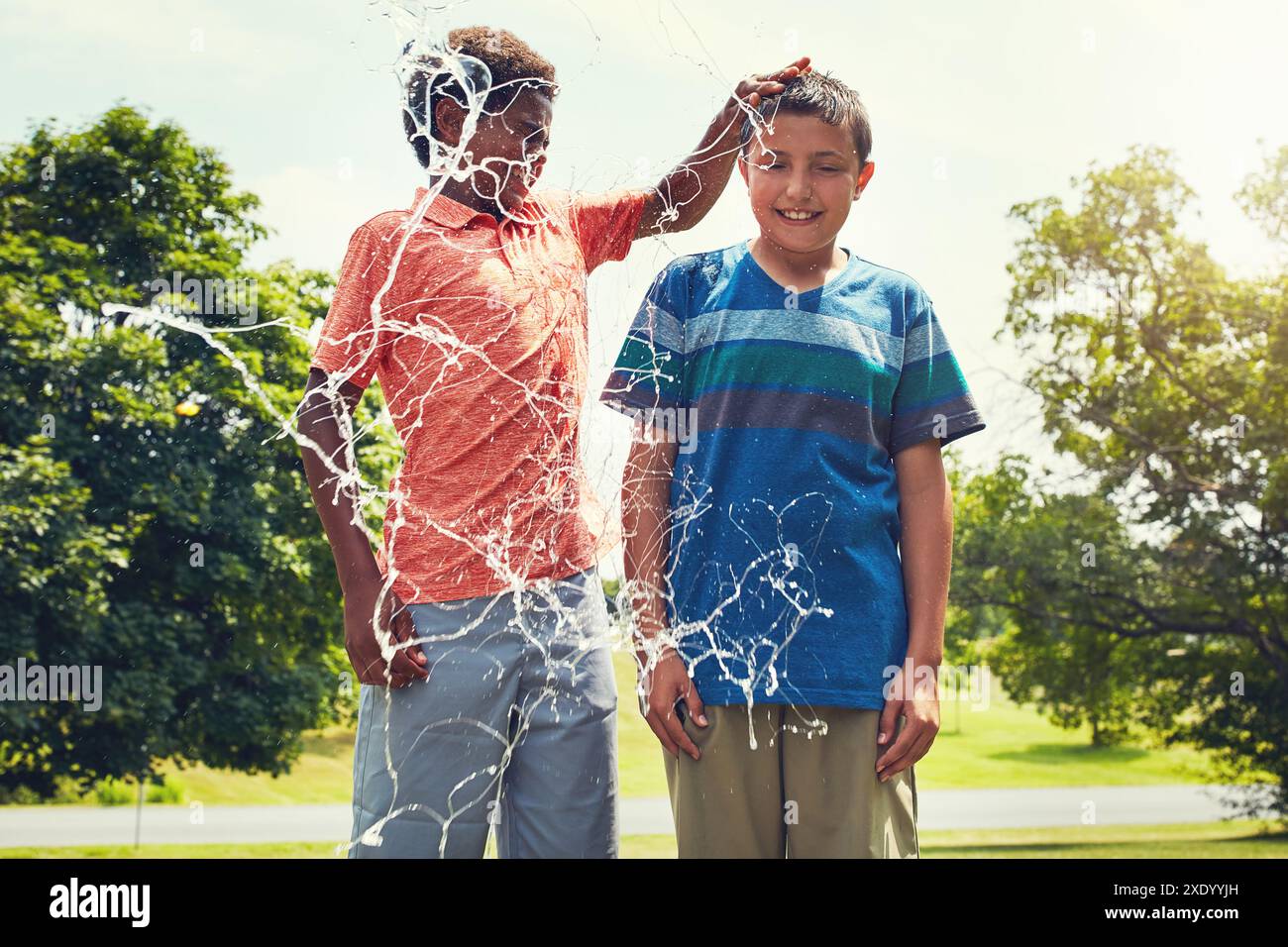 Children, splash and water balloon for friends in a park with fun ...