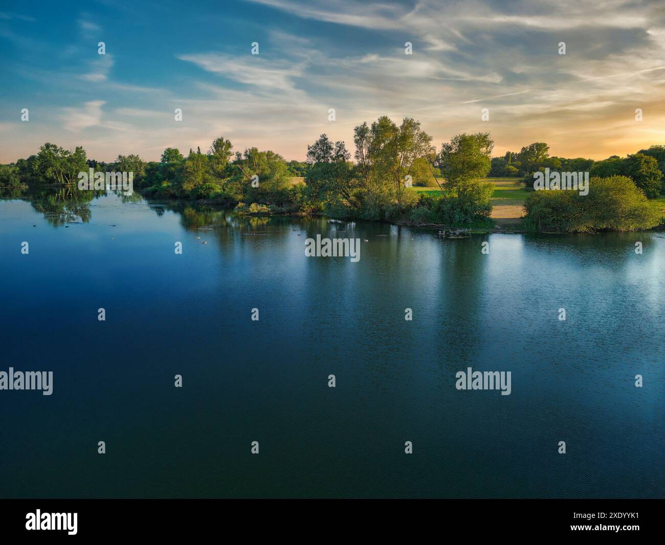 The surface of the lake is like a mirror hi-res stock photography and ...