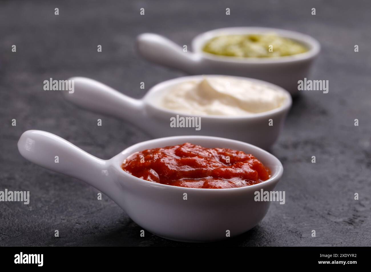 Mexican sauces for traditional dish, avocado guacamole fresh cream and ...