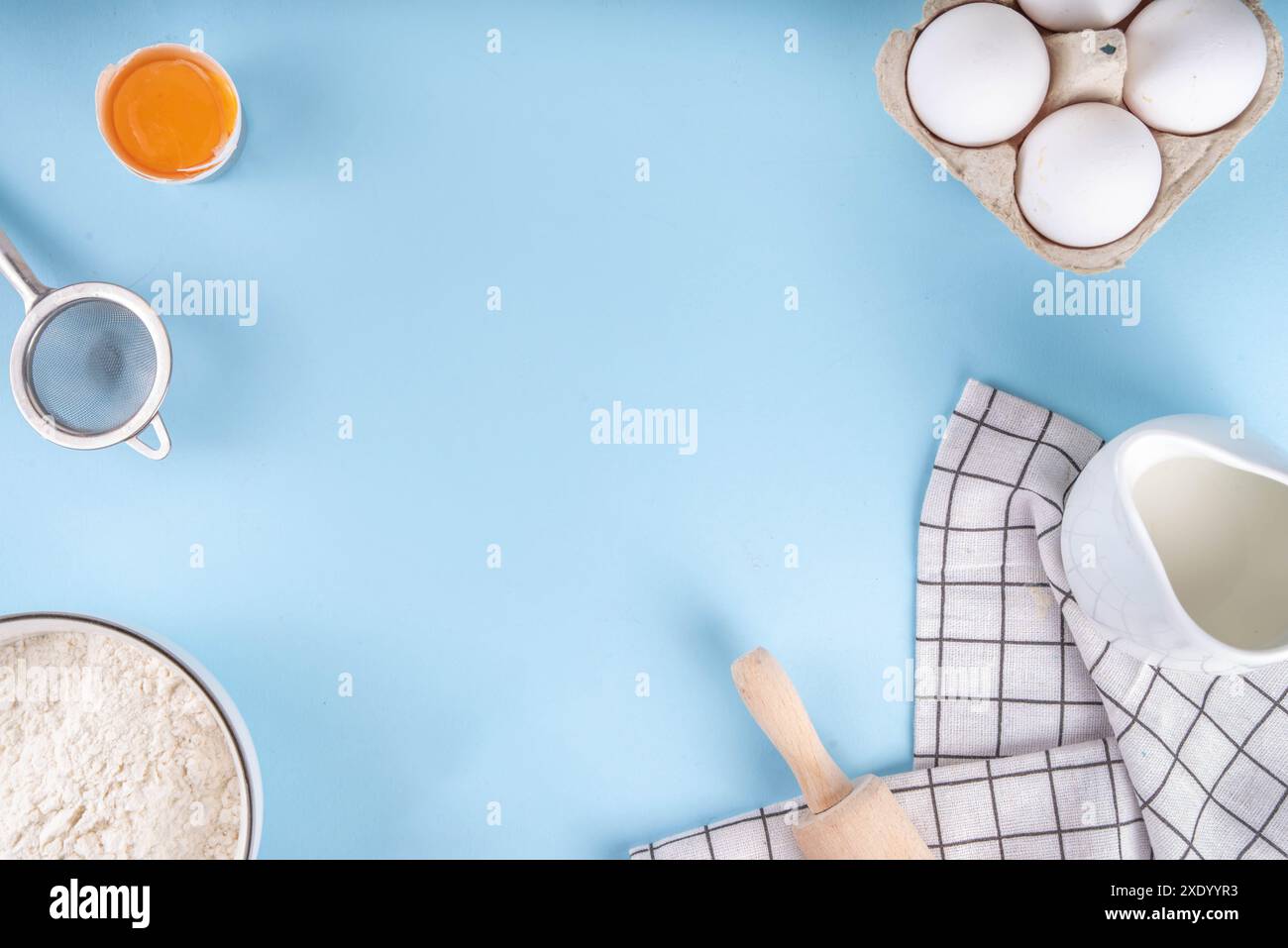Empty space baking background with bakery ingredients - flour, milk ...