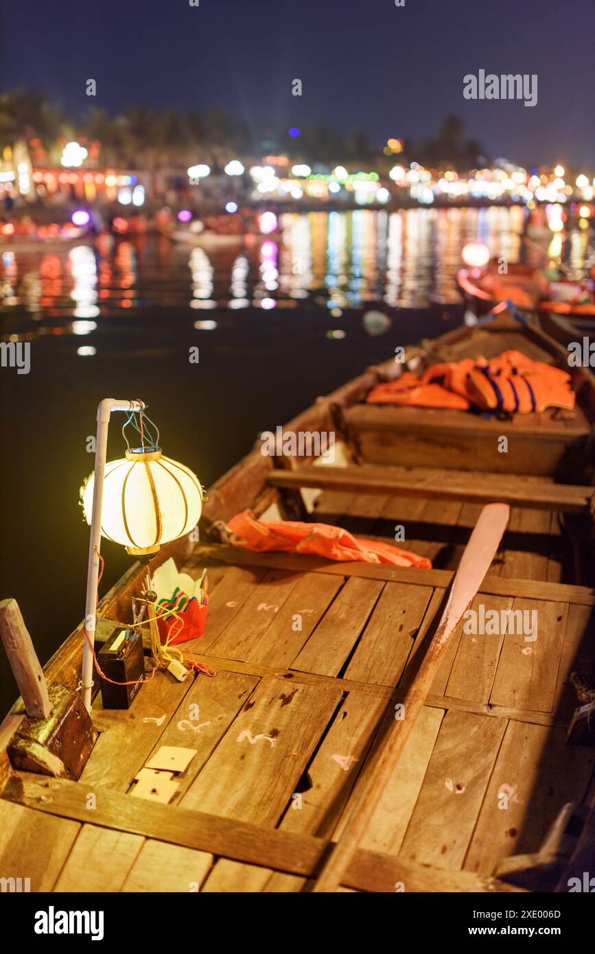 Awesome night view of traditional wooden Vietnamese boat decorated with ...