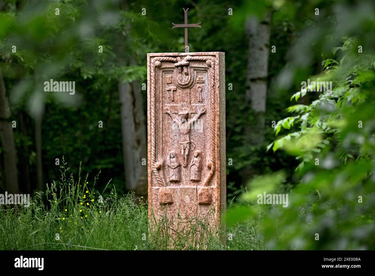 Ancient folk sculpture of the crucifixion of Jesus Christ in the middle ...