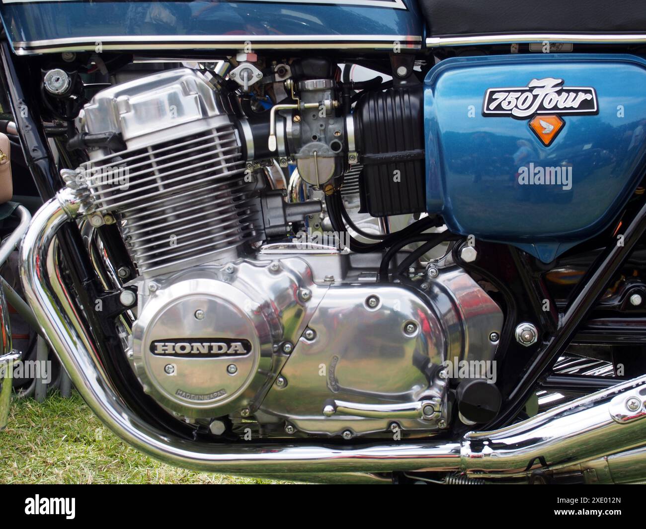 Close up of the engine and logo of a blue vintage honda 750 four motorcycle at hebden bridge ...