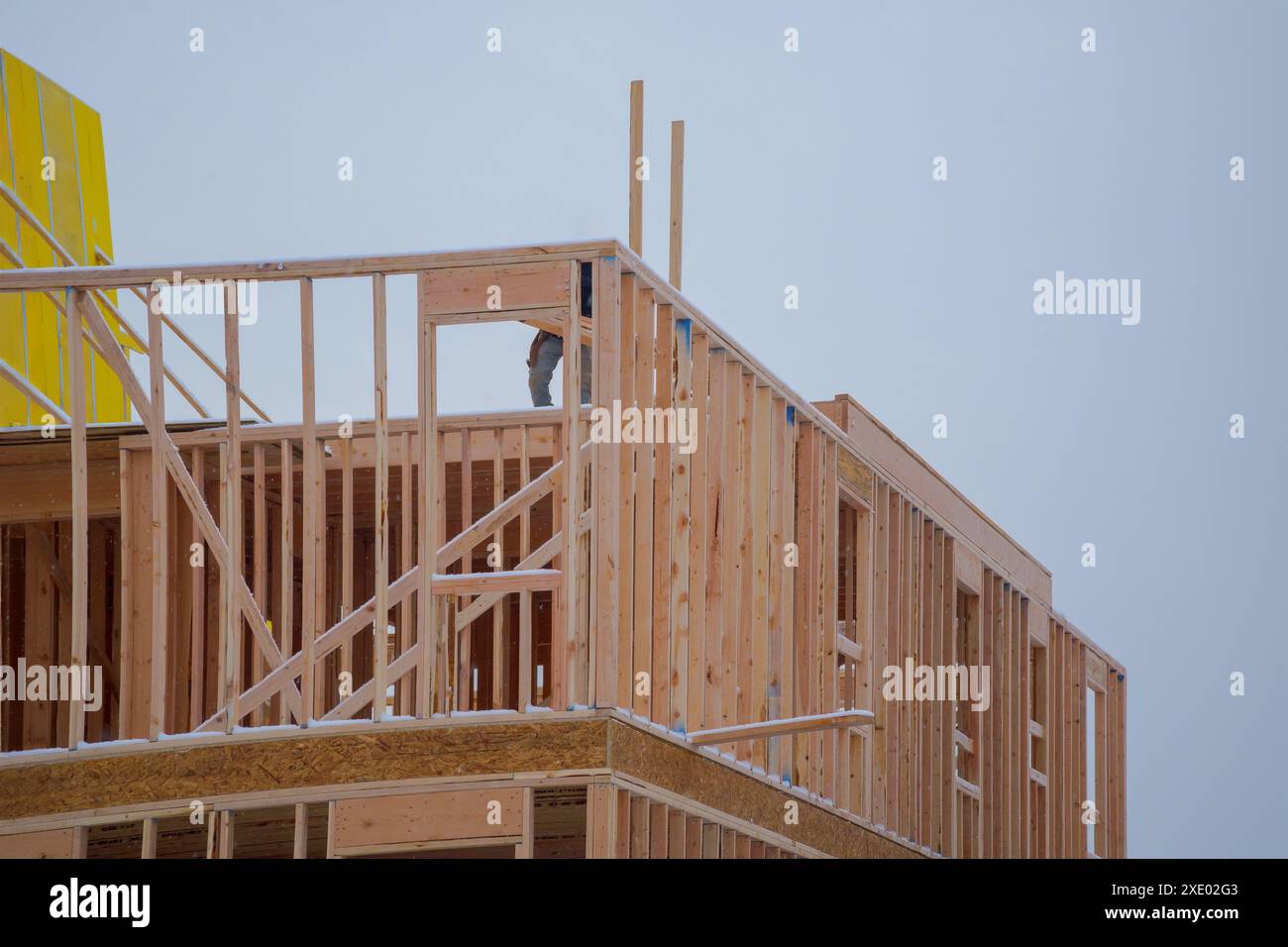 unfinished of newly constructed house, studs of wooden timber support ...