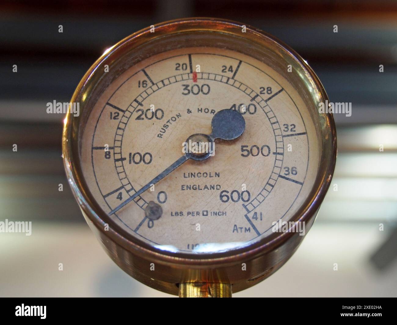 Round metal ruston industrial pressure gauge with a shiny brass case ...