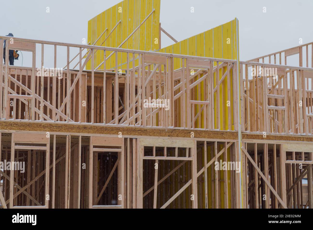 Frames of new construction home are constructed from wood attached to ...