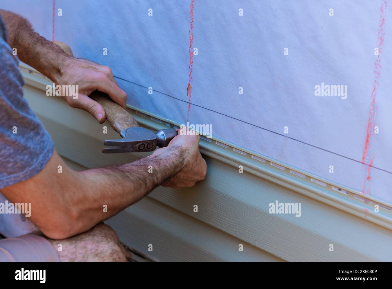 During construction facade of new home, handyman installed vinyl PVC ...