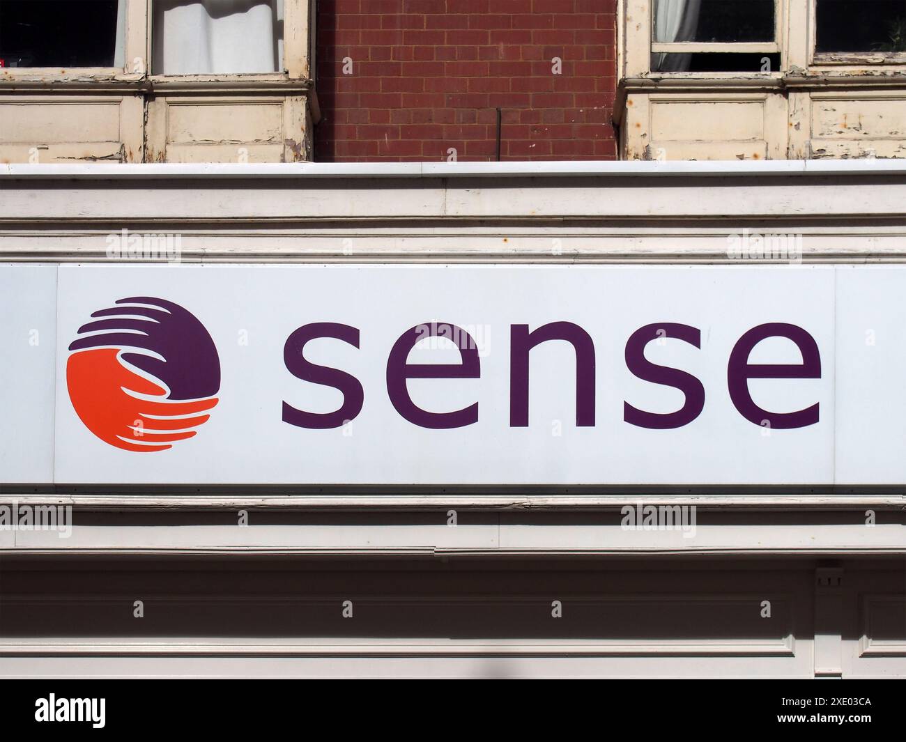 Sign and logo above a sense charity shop in scarborough Stock Photo - Alamy