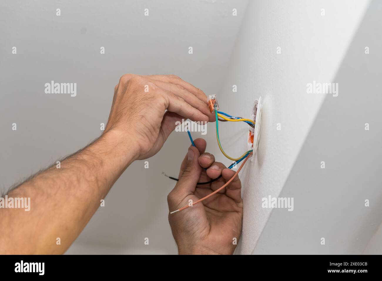Electrician wiring a socket in the house - electrician Stock Photo - Alamy
