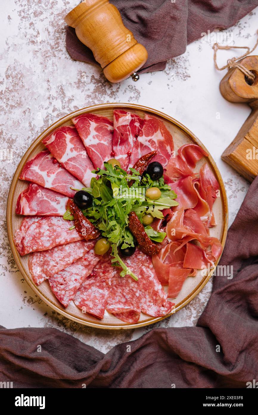 Traditional spanish jamon, prosciutto crudo, italian salami Stock Photo ...
