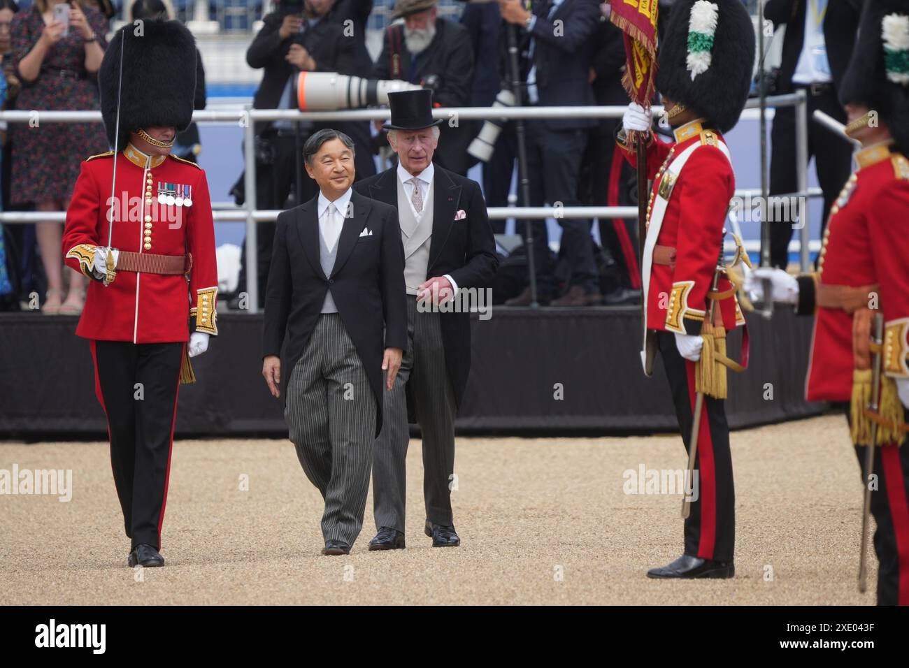 King Charles III (centre) and Emperor Naruhito inspect the guard during the ceremonial welcome ...
