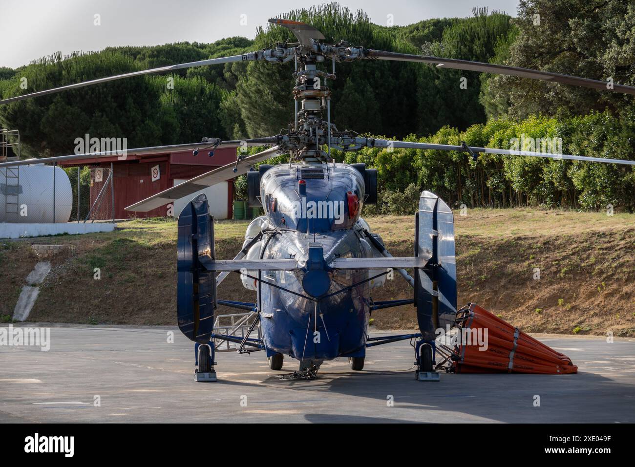 Firefighting helicopter parked at the heliport waiting for a forest ...