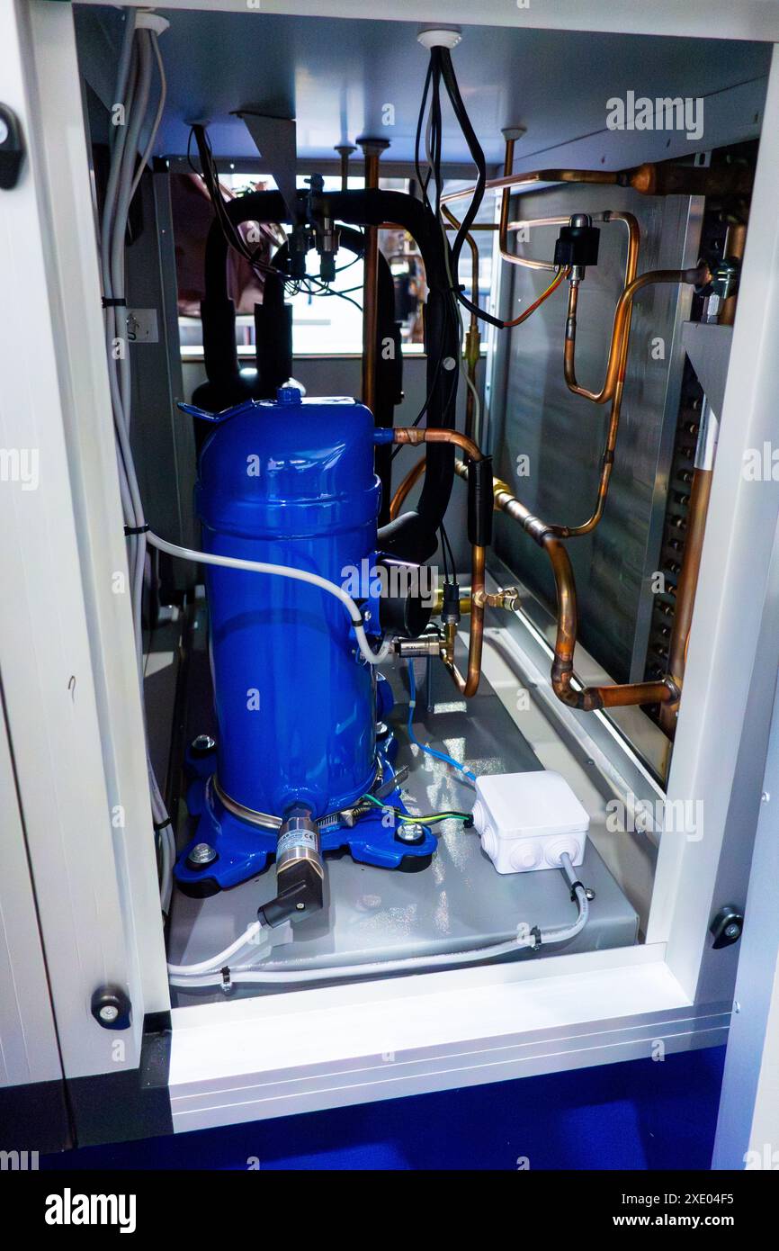 The compressor of the refrigerator with copper pipes Stock Photo - Alamy