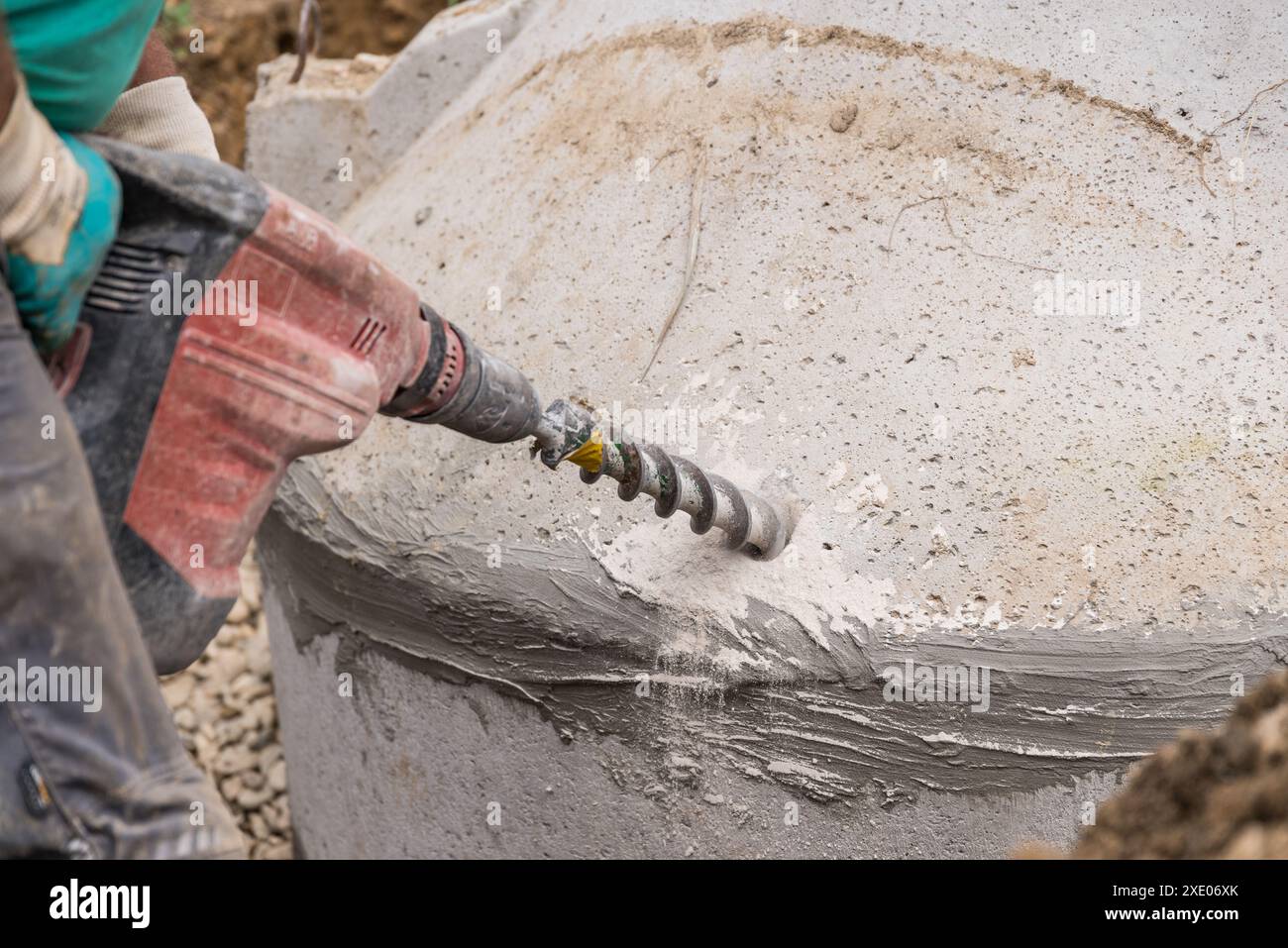 Construction worker on a construction site with a hammer drill ...