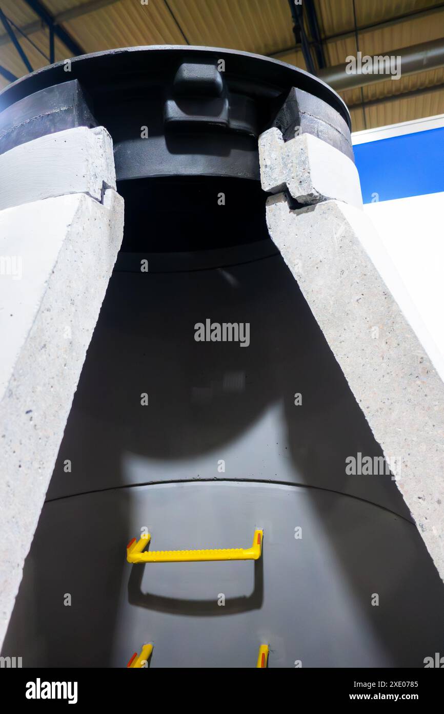 Concrete well with hatch. Sectional view Stock Photo - Alamy