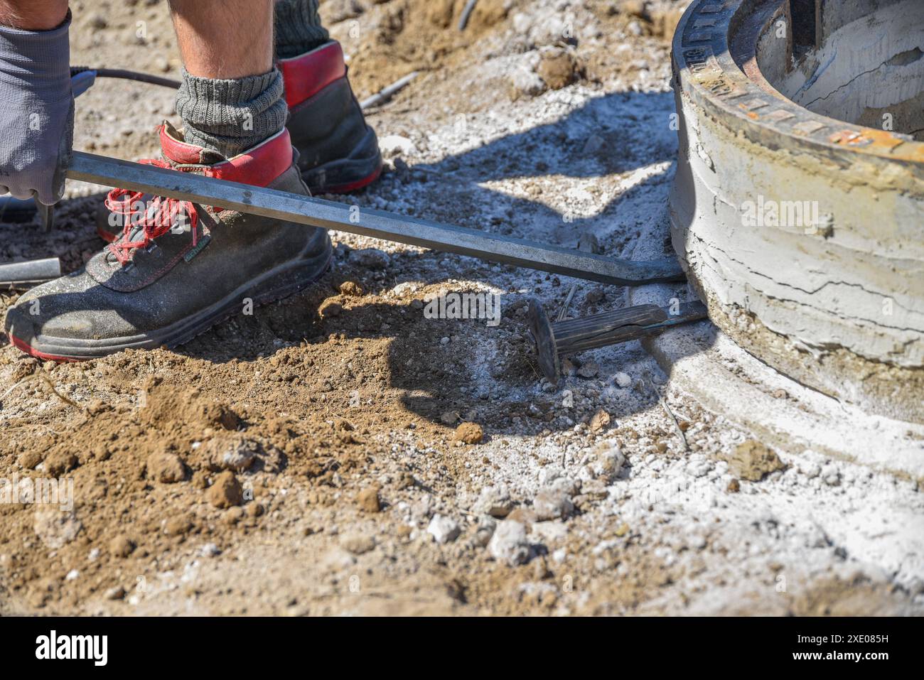Craftsman on site with chisel for concrete work Stock Photo - Alamy