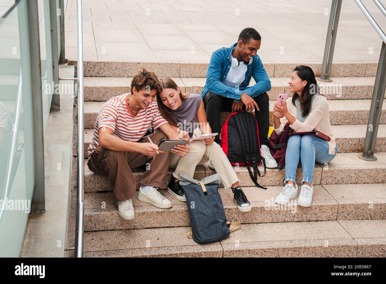 School girls talking on steps hi-res stock photography and images - Alamy