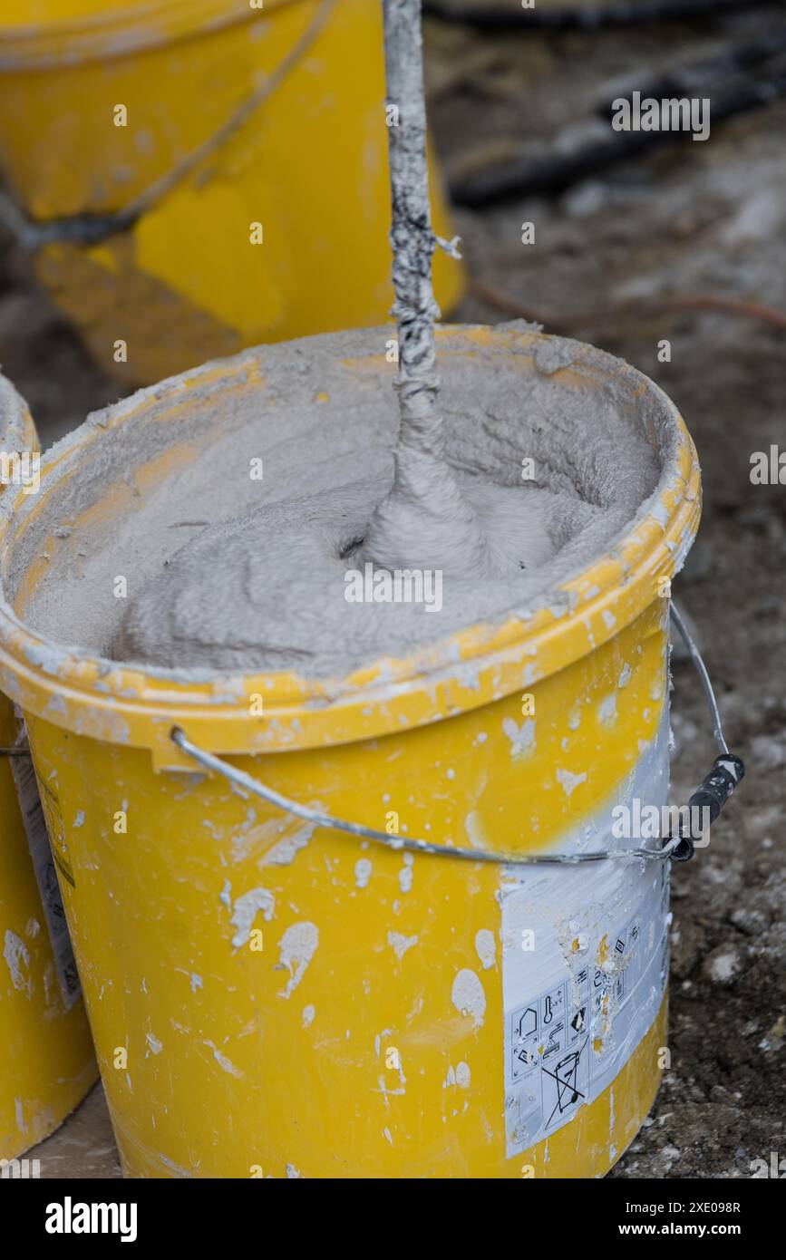 Mixing concrete with mortar mixer - handyman and tools Stock Photo - Alamy