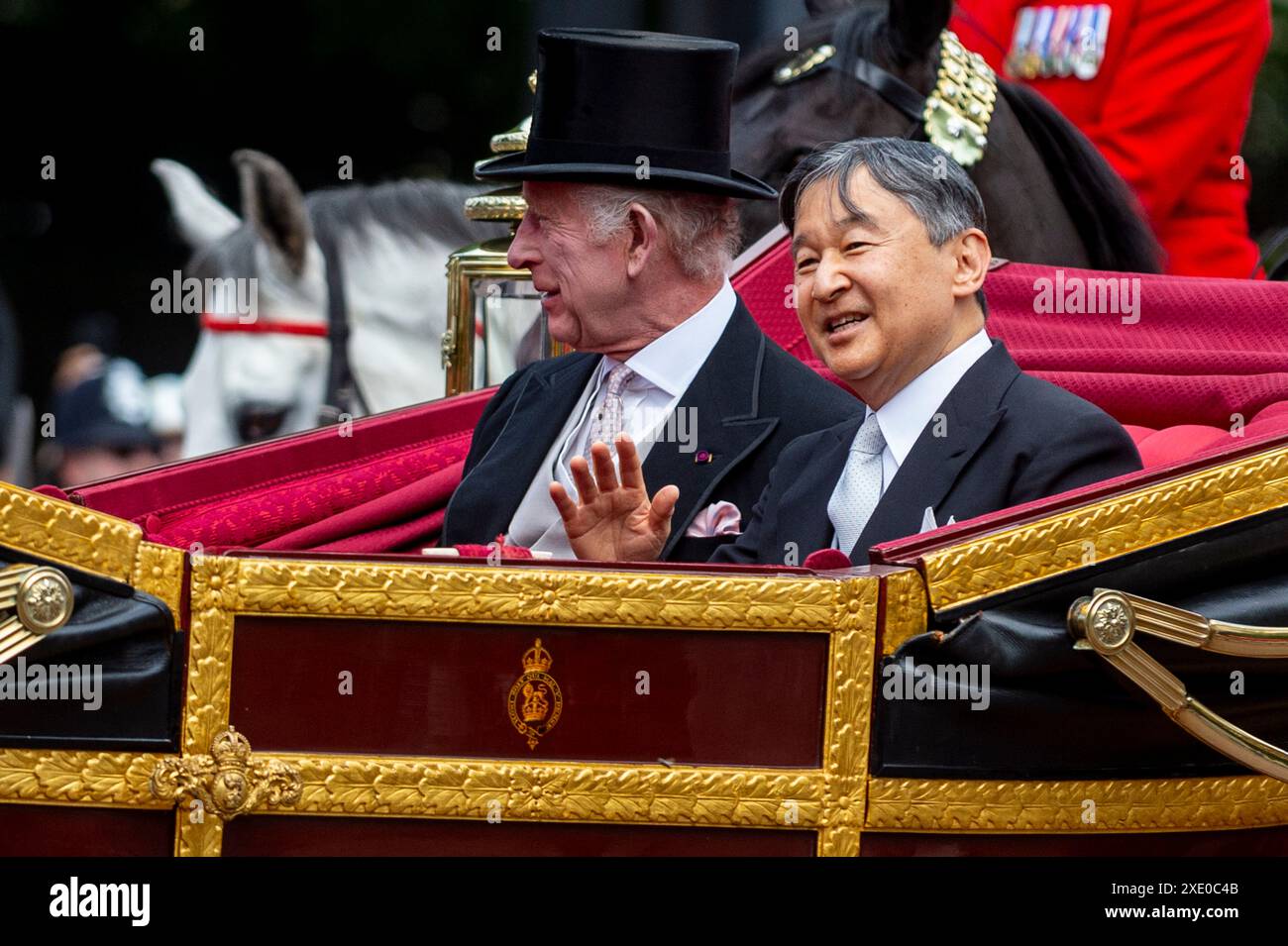 London, UK. 25 June 2024. (R) The Emperor of Japan rides in the 1902 ...