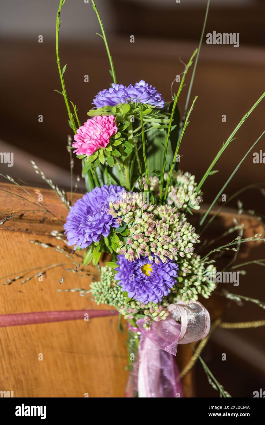 Festive flower arrangement with colorful flowers and bow - bouquet ...