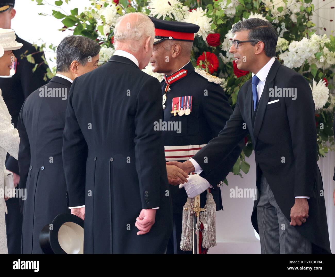 Prime Minister Rishi Sunak shakes hands with Emperor Naruhito of Japan at the Ceremonial Welcome ...