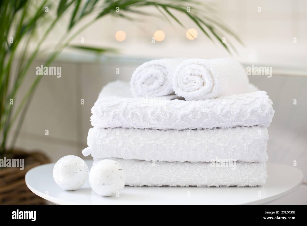 Rolled white towels in the bathroom Stock Photo - Alamy