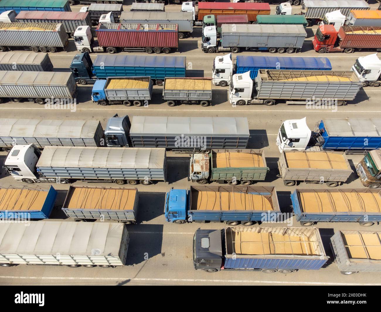 Trucks loaded with grain are waiting, top view. Trucks in the port ...