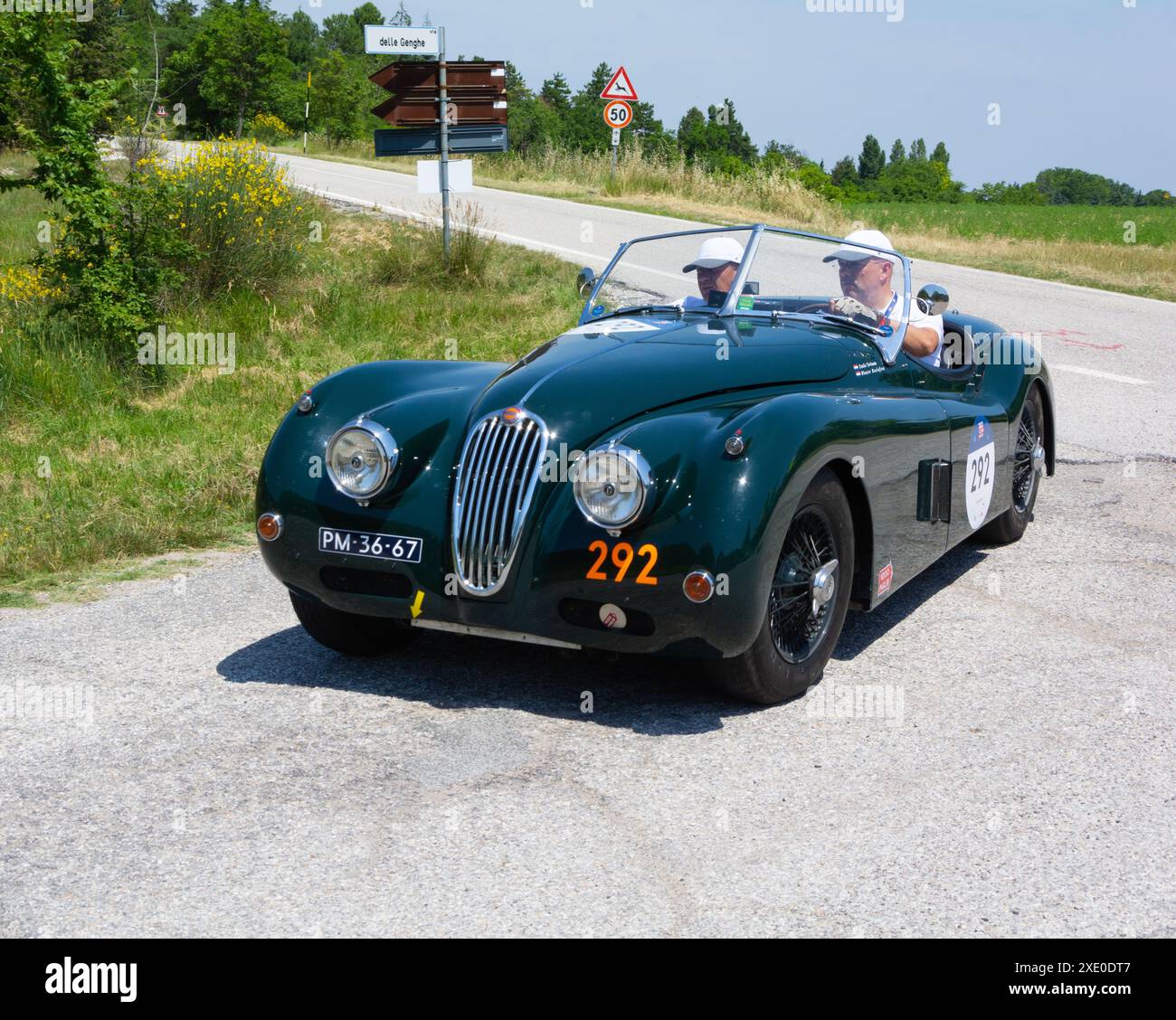 JAGUAR XK140 OTS ROADSTER 1956 on an old racing car in rally Mille ...
