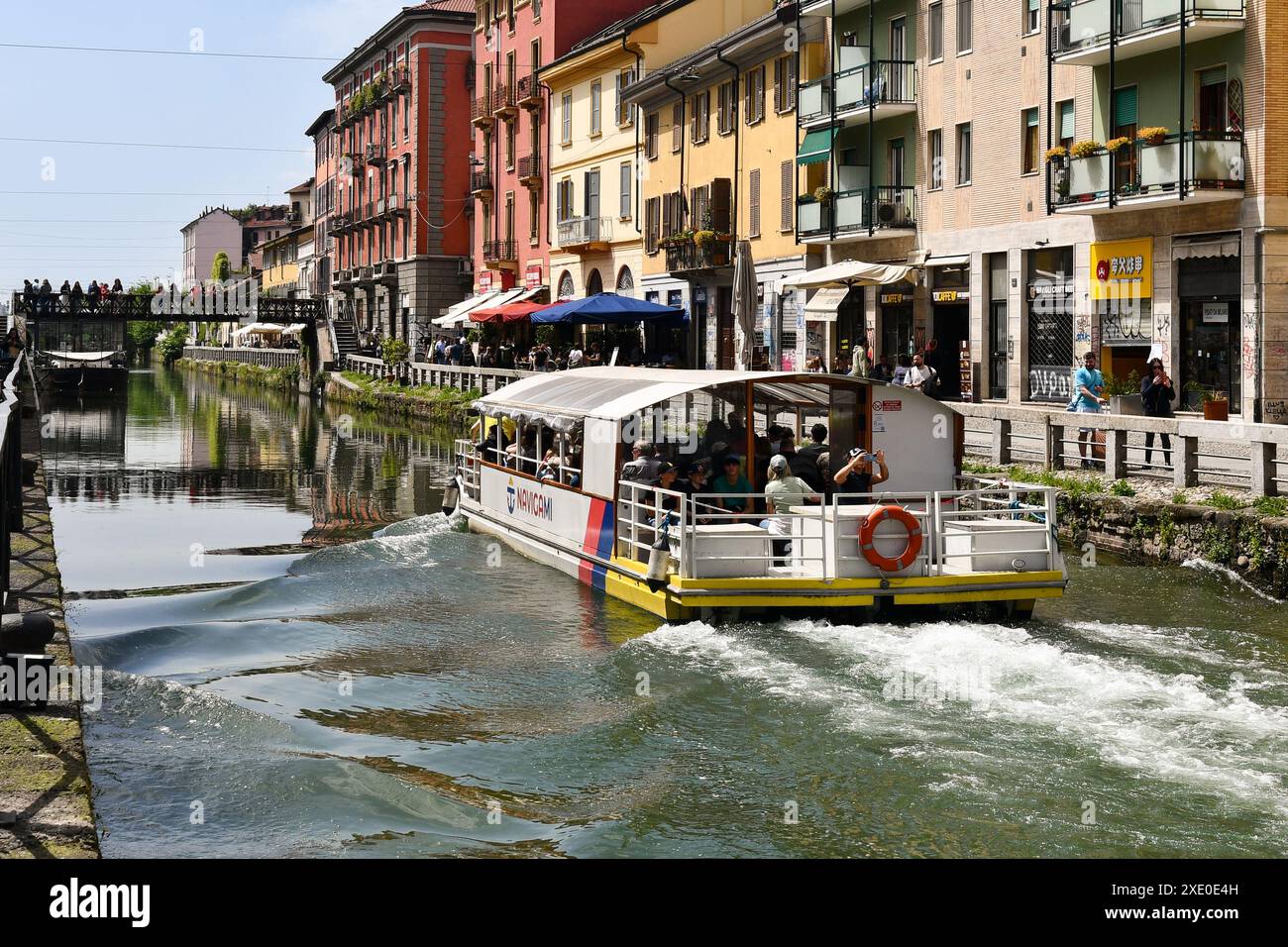 Tour boat on the Naviglio Grande waterway with the so-called "Ponte ...