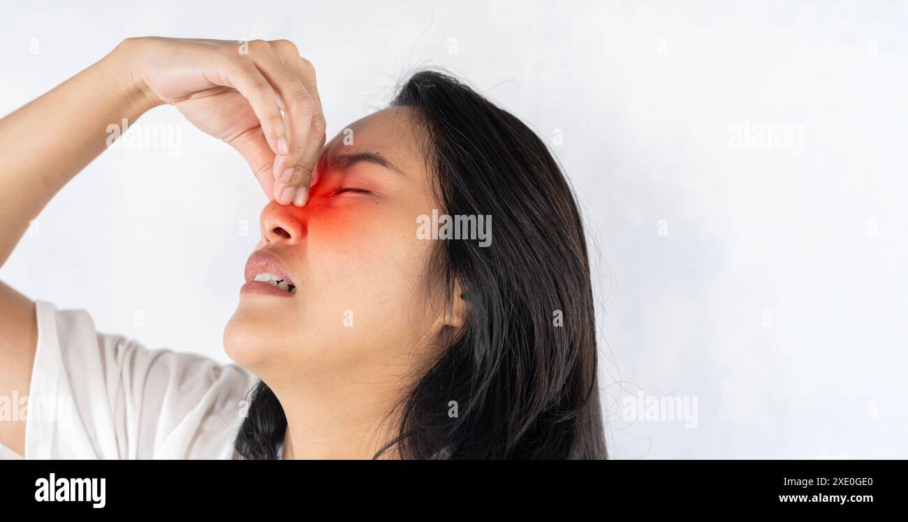 Asian woman hurts her nose because she has a cold, having a headache ...