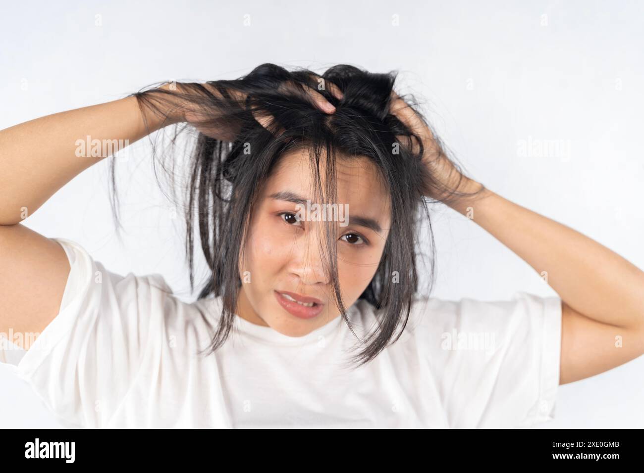 Broken hair, beautiful sad young woman with long disheveled hair ...