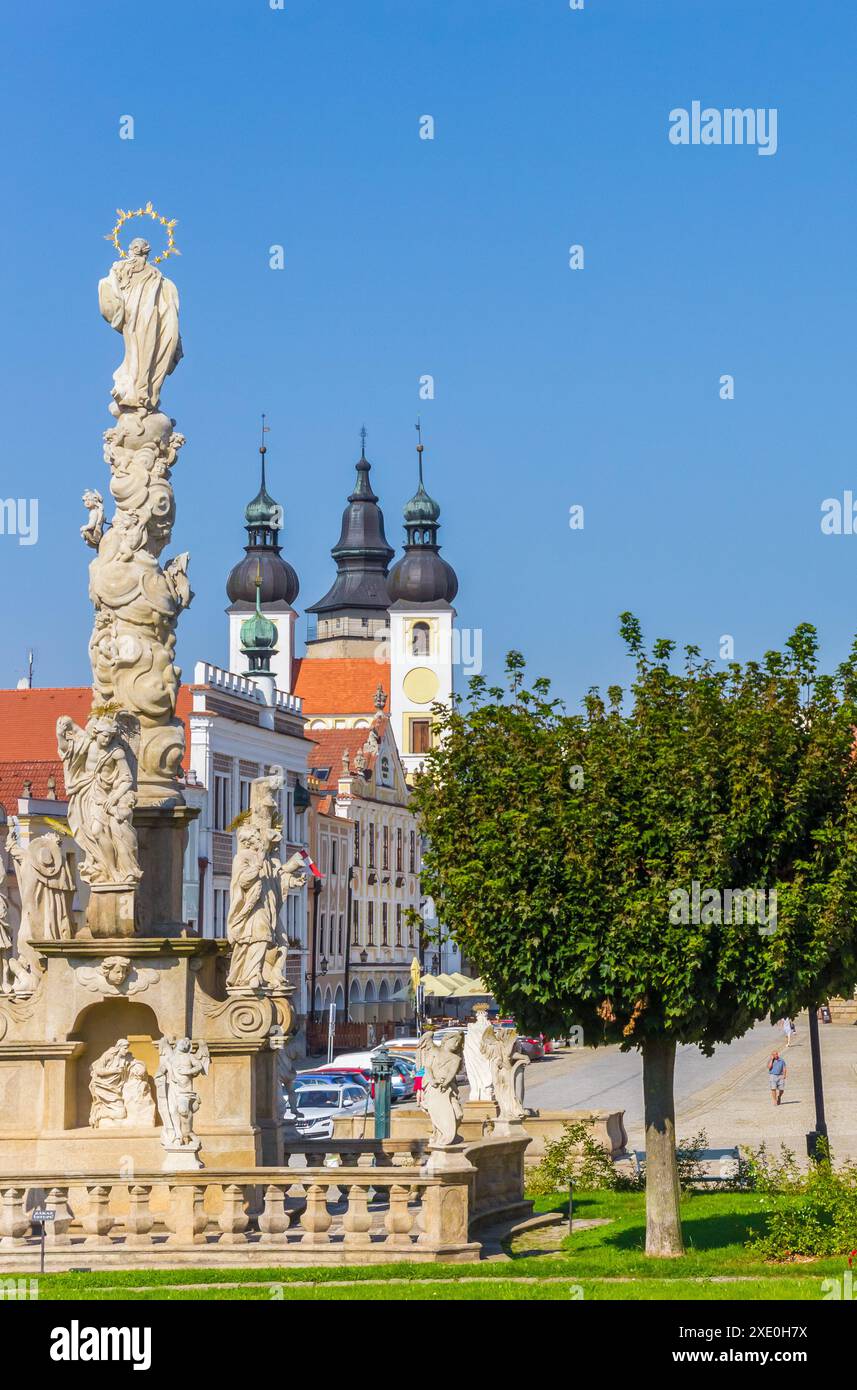 Sculpture and church towers on the main square of Telc, Czech Republic ...