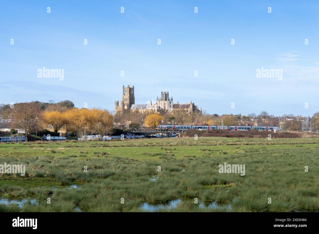 An east midlands intercity train passes in front of Ely Cathedral under ...