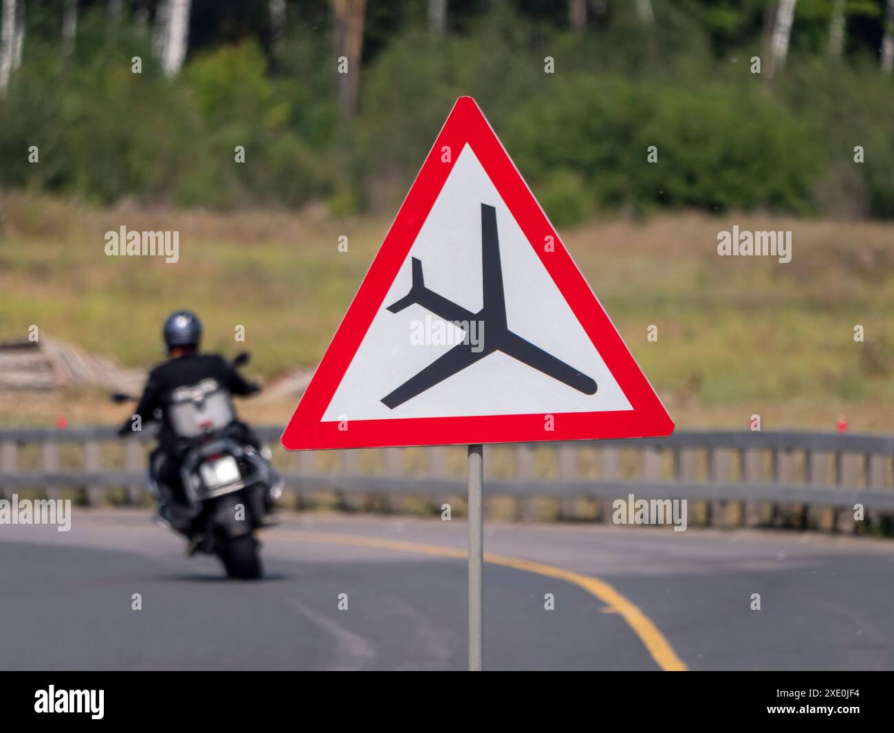 Red triangle warning sign cautioning that this is a low flying aircraft ...