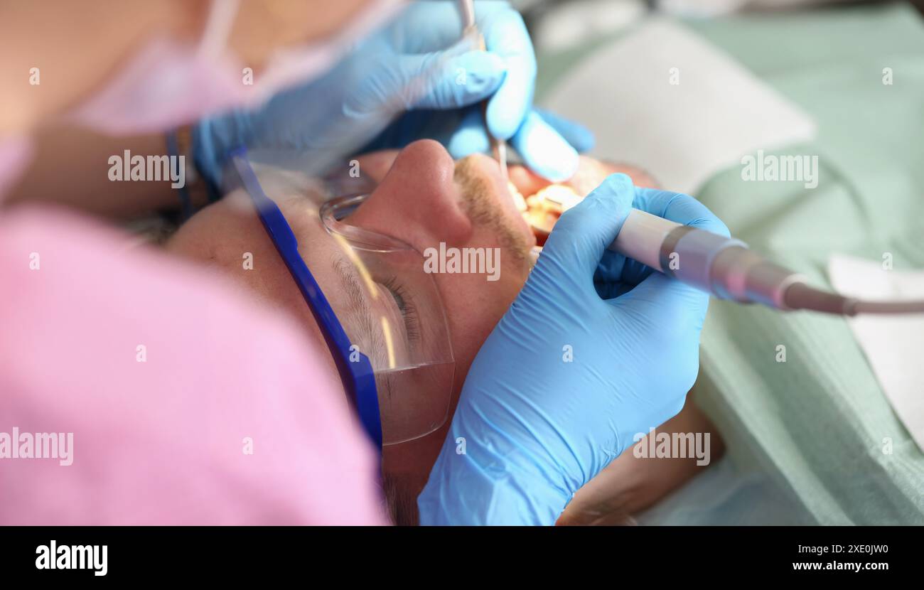 Dentist treating teeth young hi-res stock photography and images - Alamy