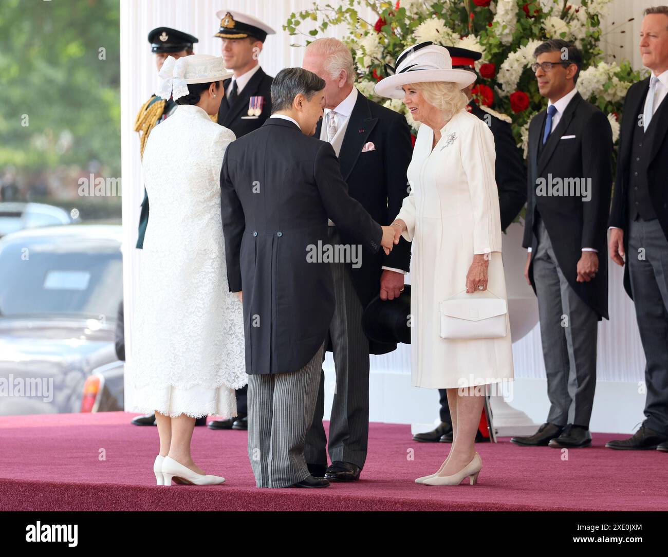 King Charles III and Queen Camilla shake hands with Emperor Naruhito and Empress Masako of Japan ...