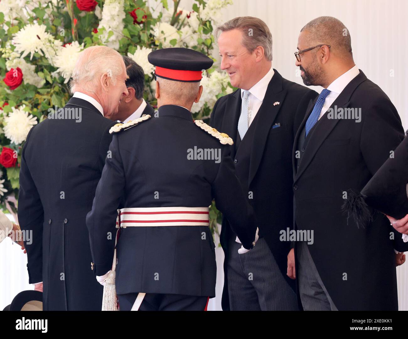 King Charles III (left) shakes hands with Foreign Secretary Lord David ...