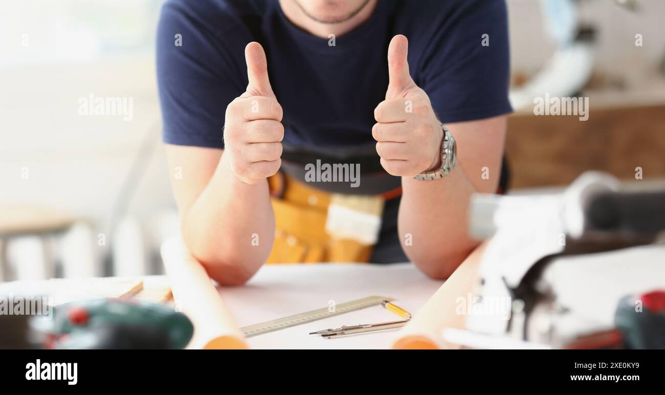 Silhouette of male builder showing thumbs up gesture. Successful ...