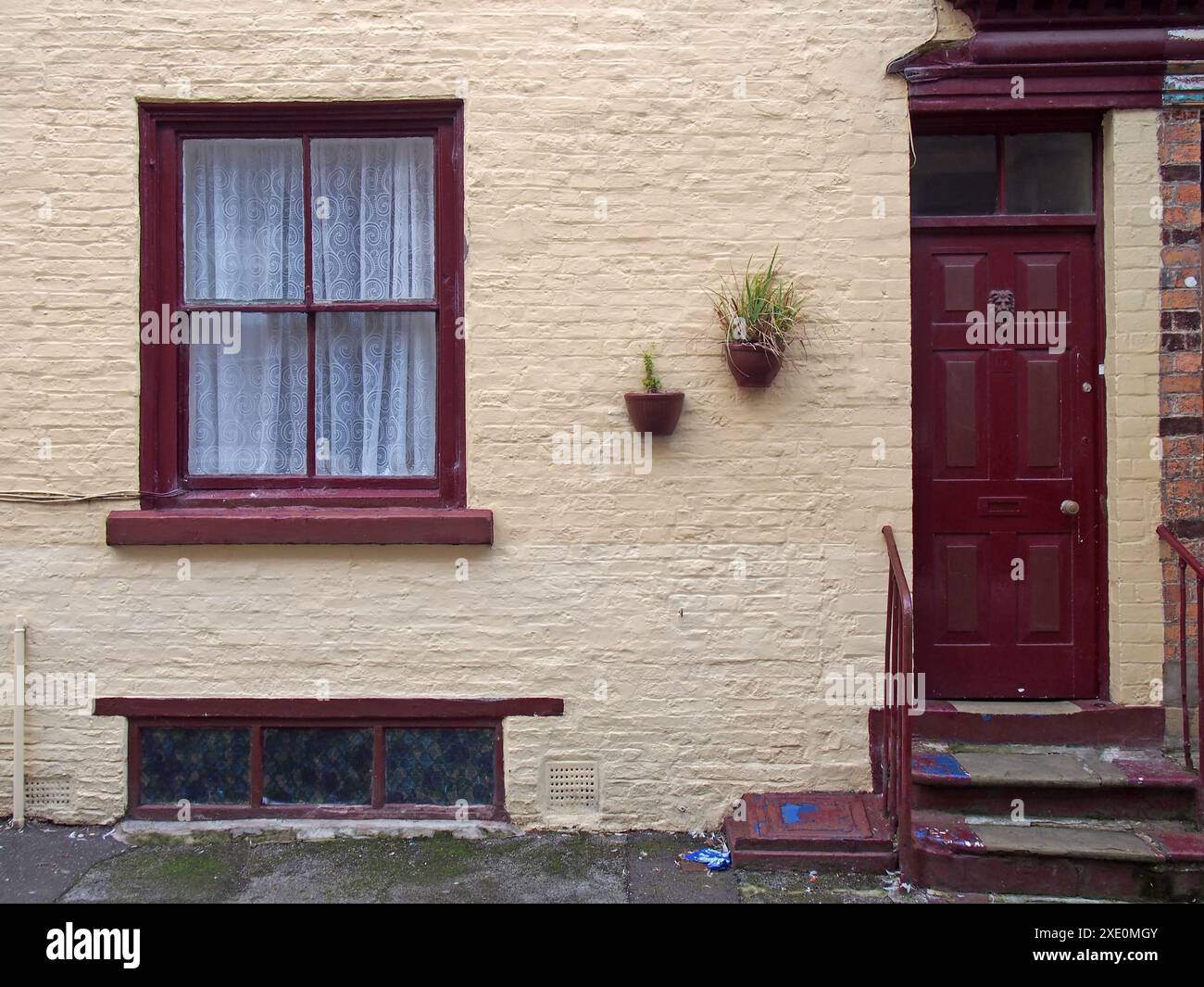front view of a typical old small english terraced brick house with ...