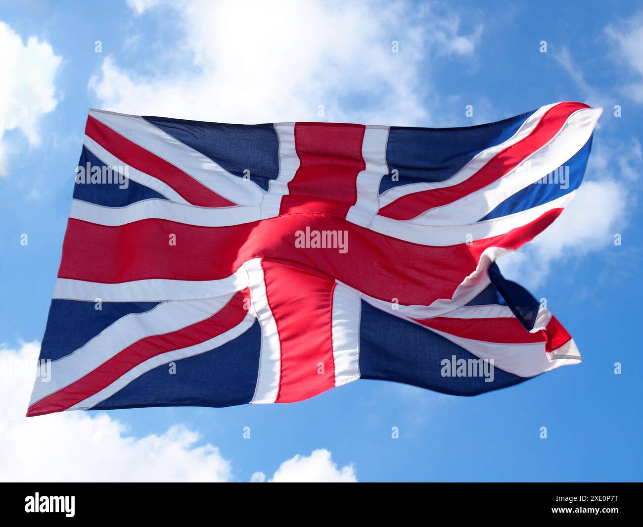 British union flag flying against a blue cloudy sky Stock Photo - Alamy