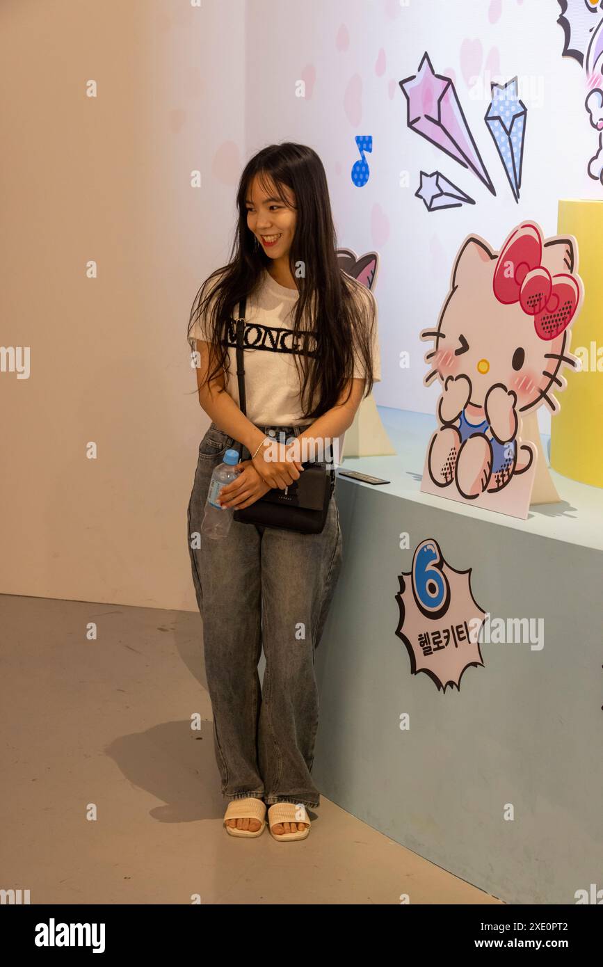 girl posing beside character, Hello Kitty 50th-Anniversary Special ...