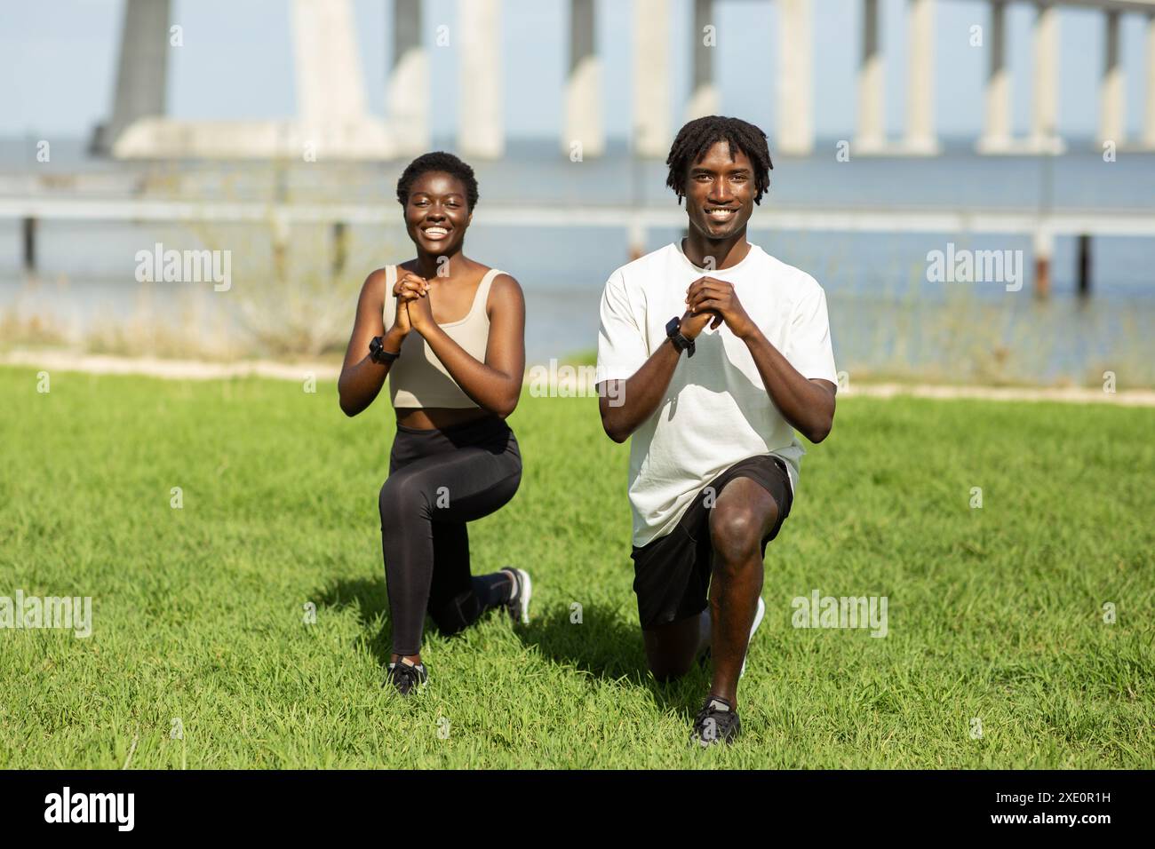 Active couple performing lunges hi-res stock photography and images - Alamy