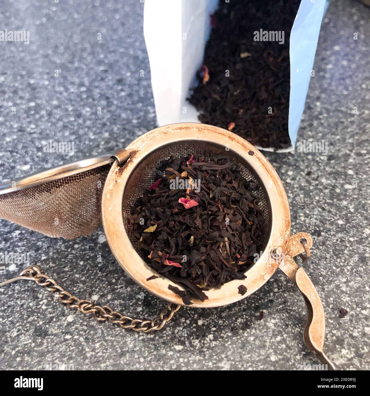 Black tea in strainer hi-res stock photography and images - Alamy