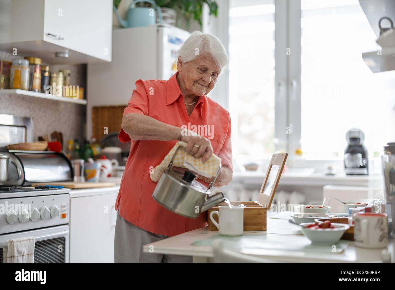 Woman preparing tea in hi-res stock photography and images - Alamy